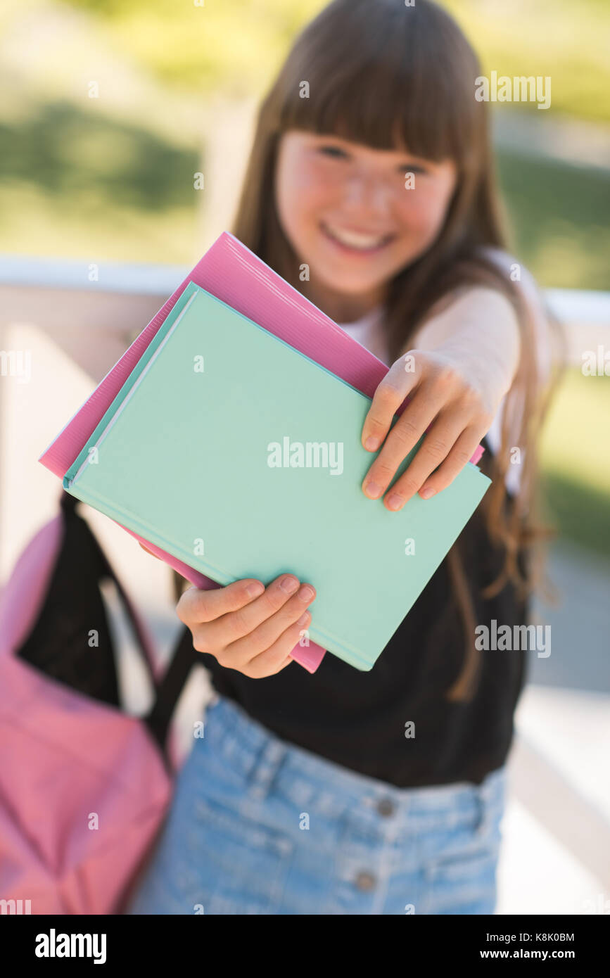 teenager holding books Stock Photo - Alamy
