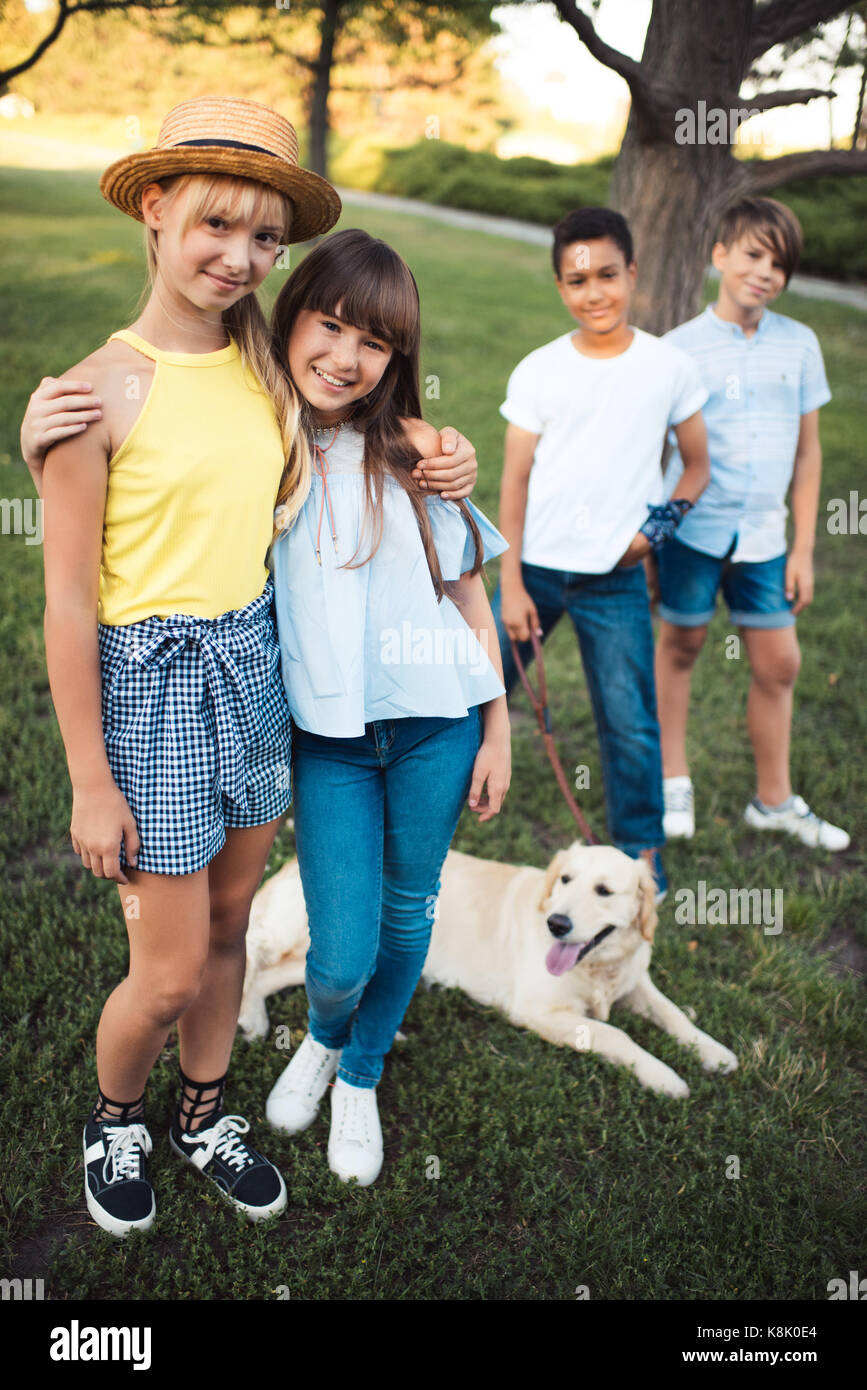 teenagers with dog in park Stock Photo - Alamy