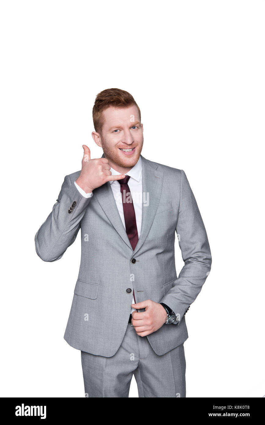 businessman showing call me sign Stock Photo - Alamy