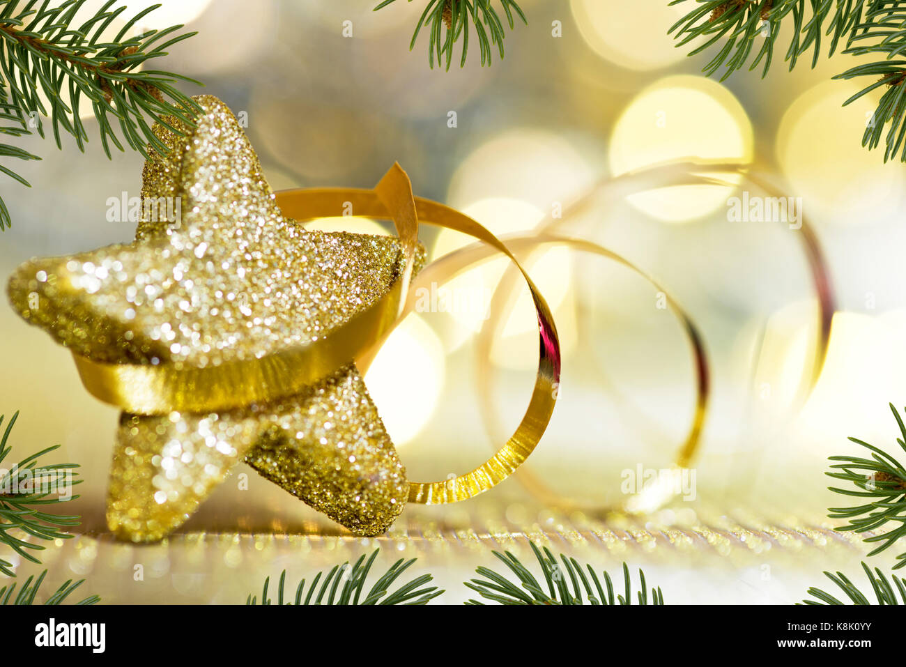 Golden Christmas Star with Ribbon and Needles Stock Photo - Alamy