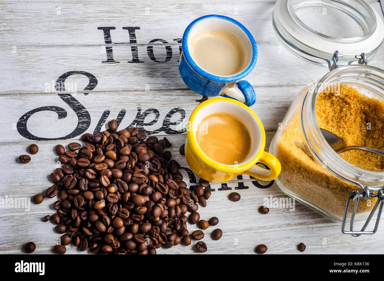 cup of coffee and coffee beans and cane sugar Stock Photo - Alamy