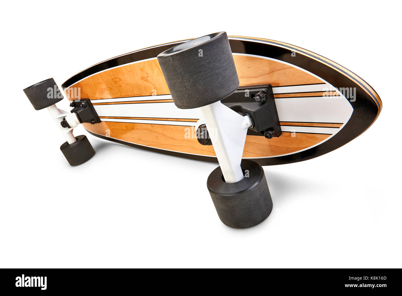 Dynamic side view of a Black and wooden skate board isolated on a white ...