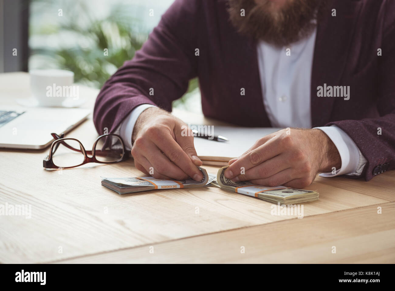businessman counting dollars Stock Photo - Alamy