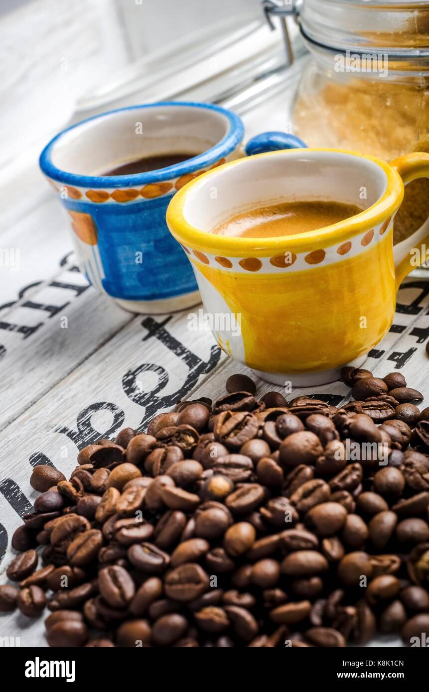 cup of coffee and coffee beans and cane sugar Stock Photo - Alamy