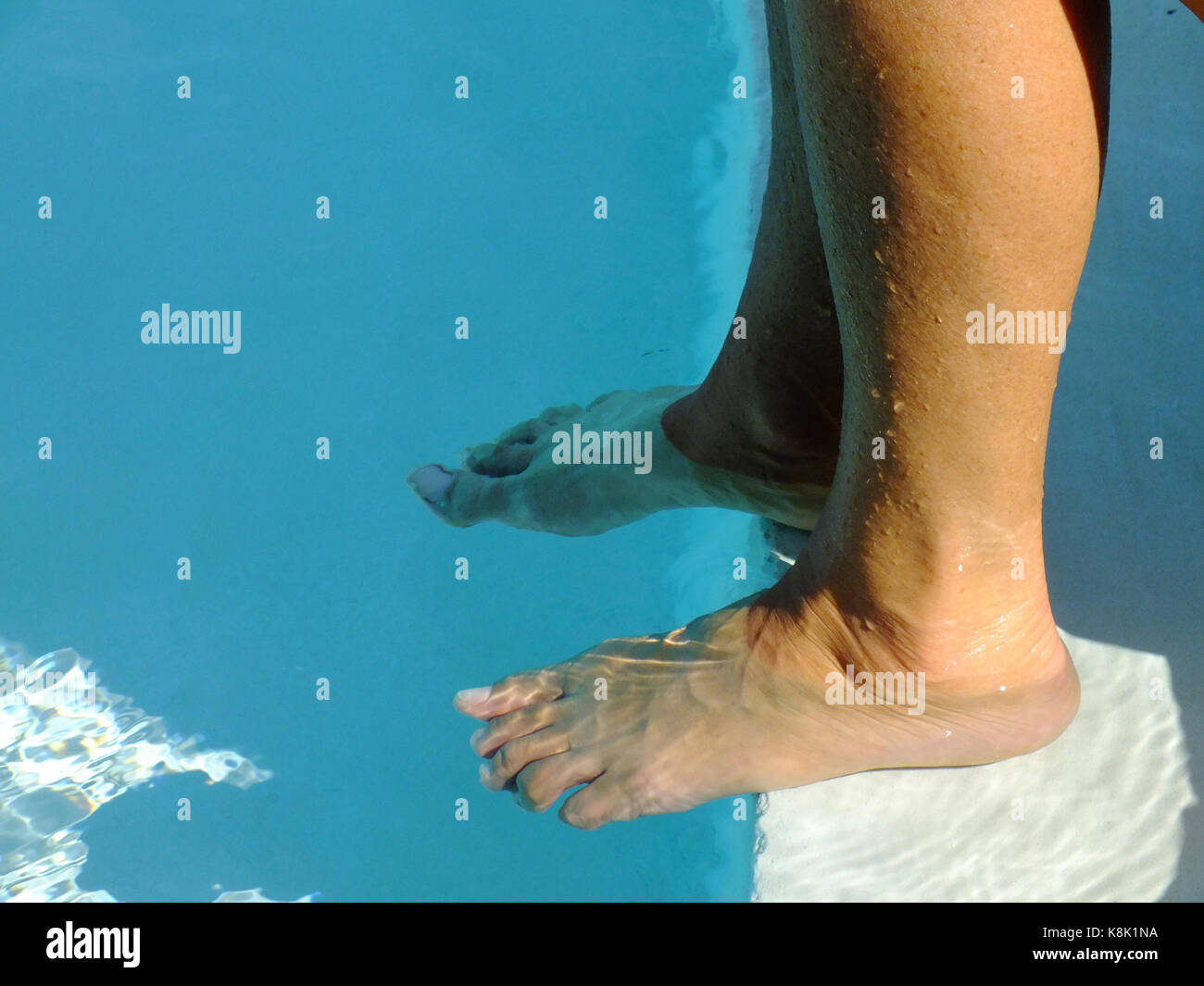 Older woman swimming in pool hi-res stock photography and images - Alamy