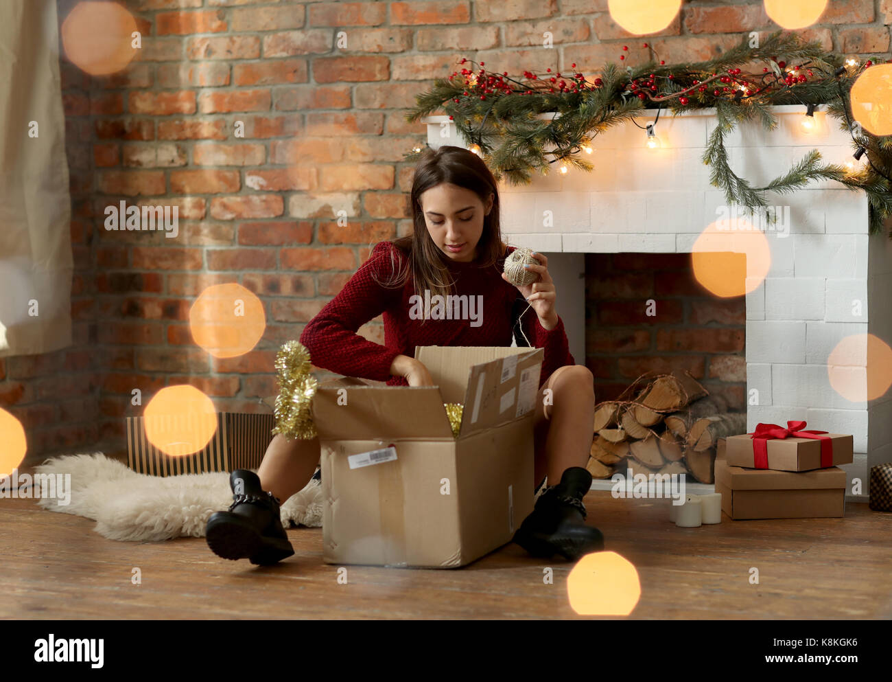 Beautiful woman at Christmas Eve Stock Photo - Alamy