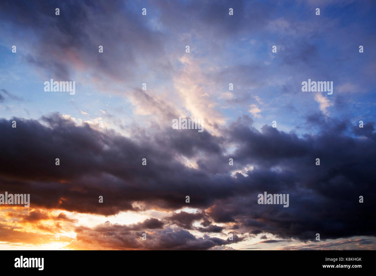 landscape during the sunset. A blue sky with clouds and various shades ...