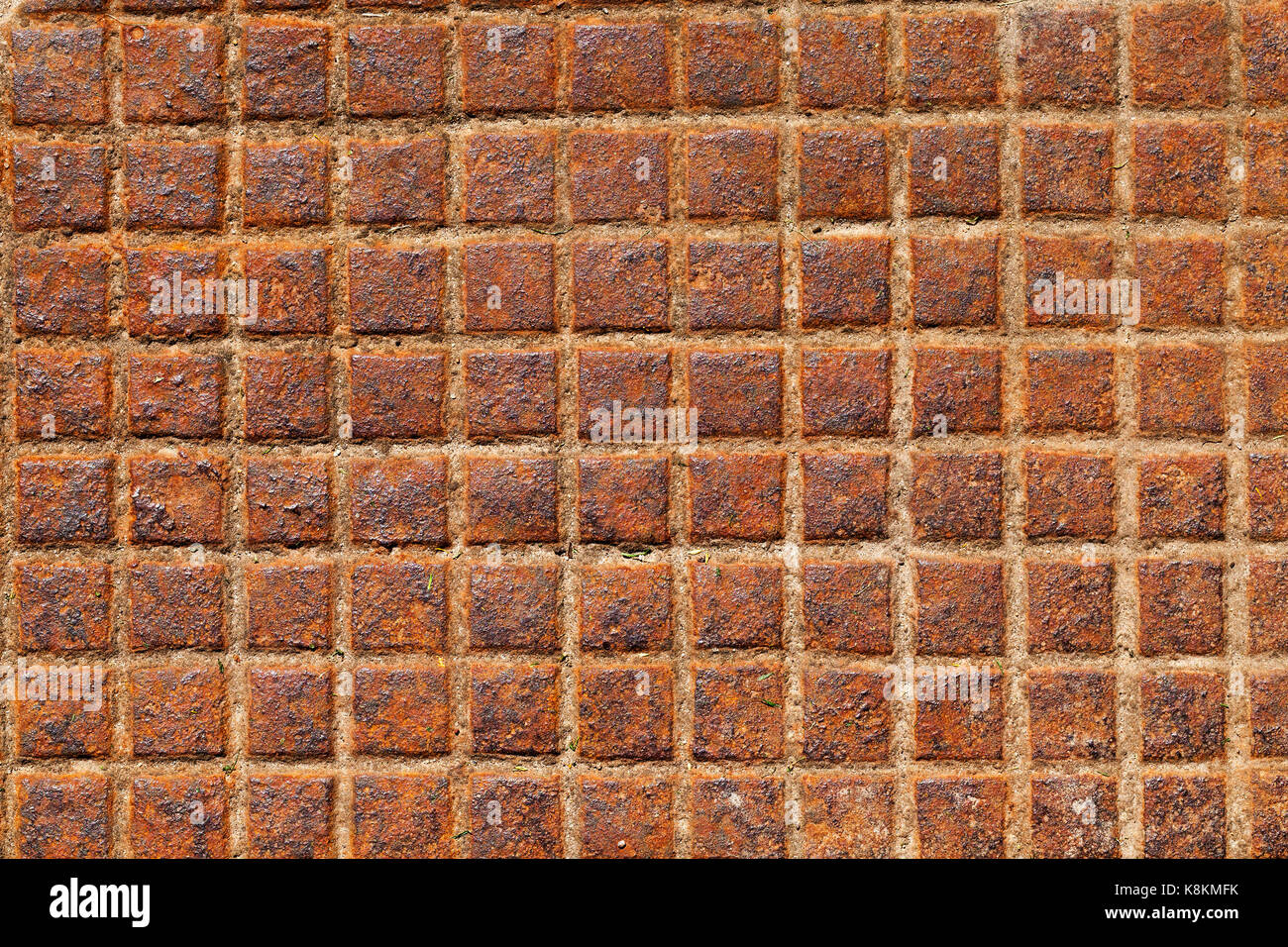 Old rusty sewer metal hatch, photographed close-up. The hatch has an ...