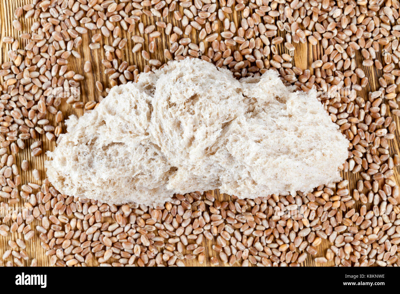 part of the pulp of a wheat loaf of bread with a torn crust, lying ...