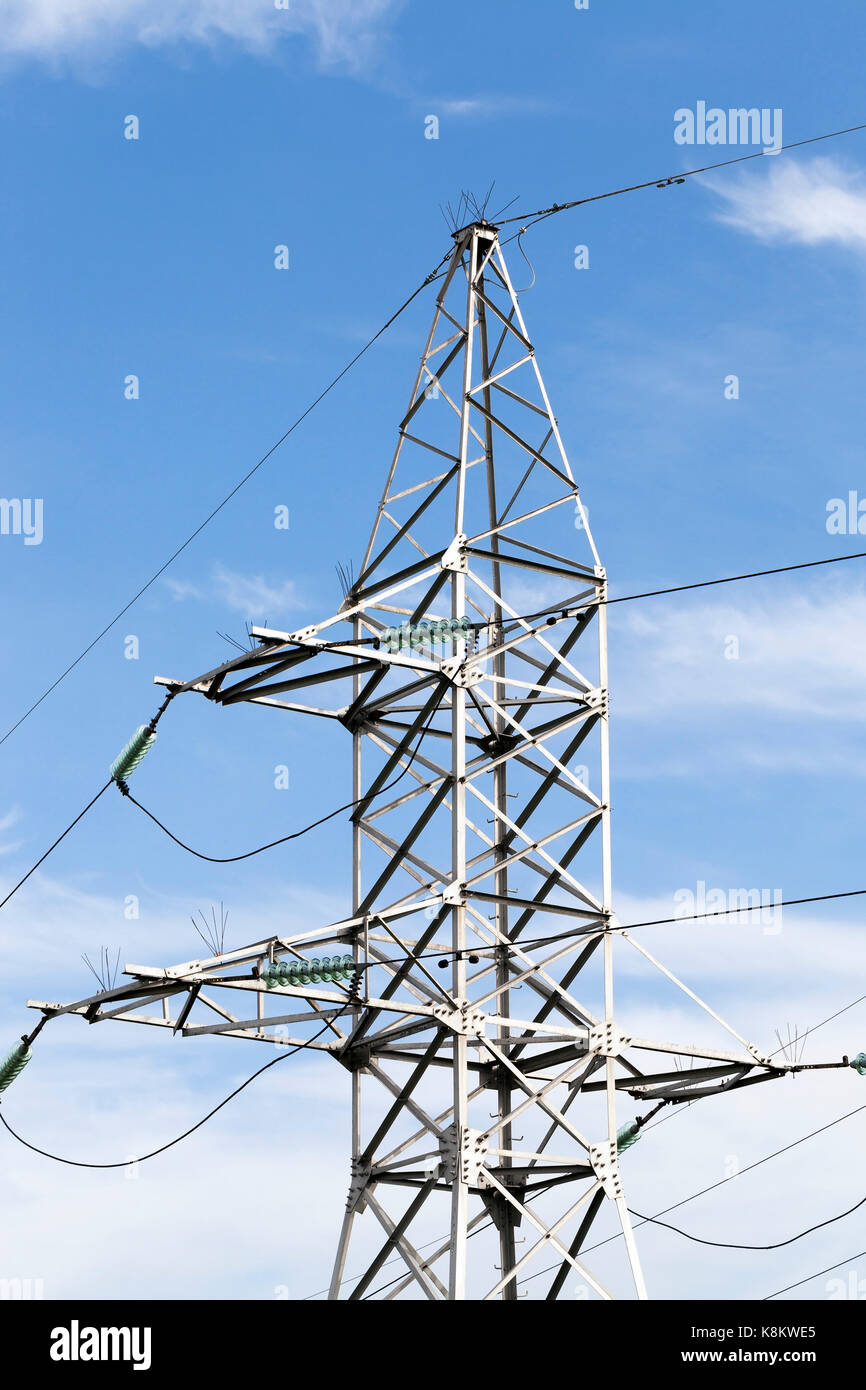 Metal high-voltage pole of an open switchgear with a glass linear ...