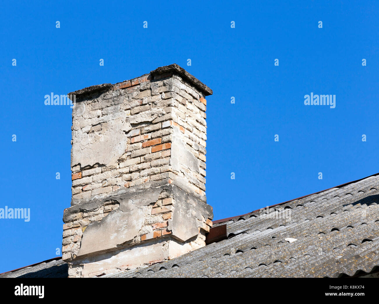 photo taken close-up of an old chimney made of brick, located on the ...