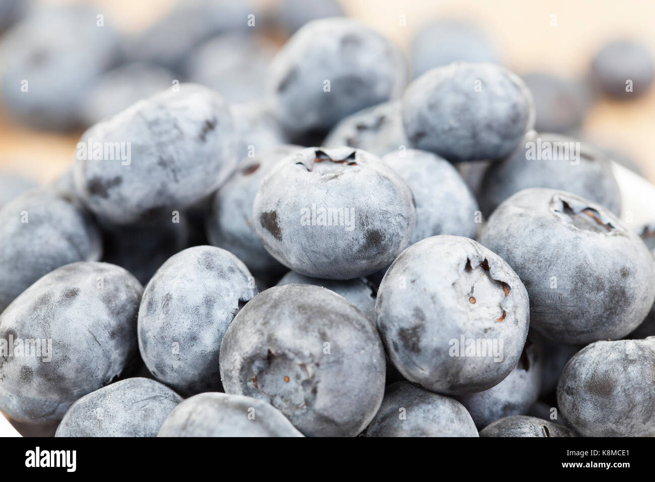 lot of blueberries, stacked on each other on the surface of the table ...