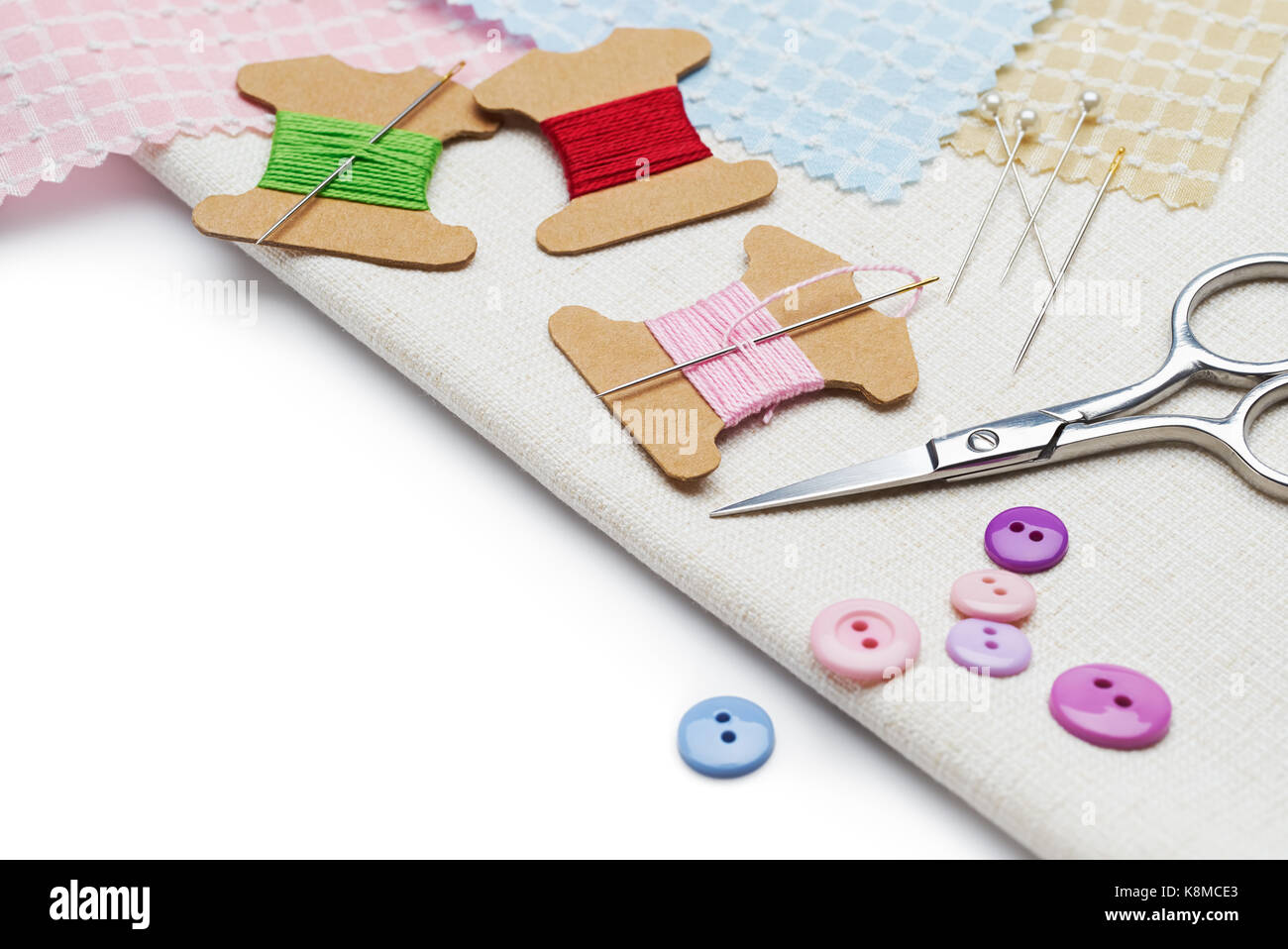 Needle and thread with other sewing tools and accessories Stock Photo ...