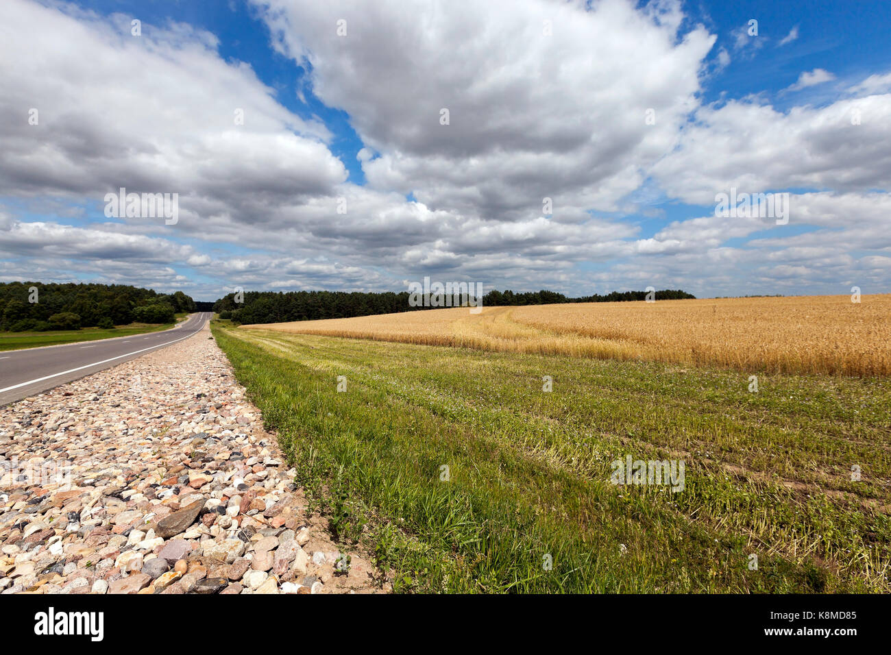 small road for cars with poor road surface. Photo closeup Stock Photo ...