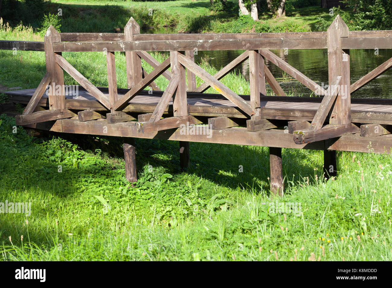 close-up photo of a wooden bridge across the river Stock Photo - Alamy