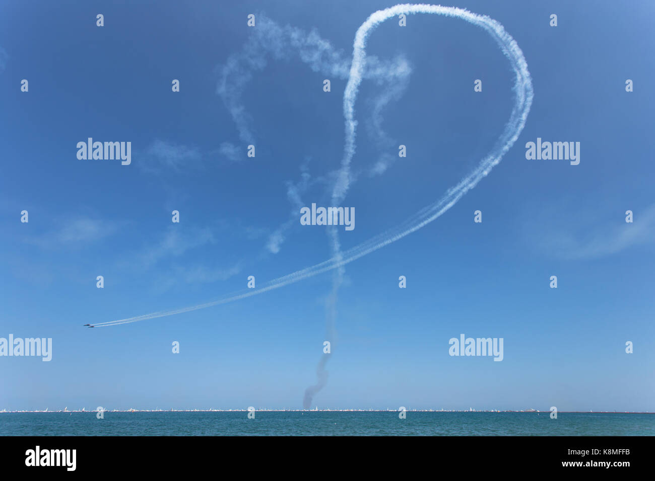 United States Navy Blue Angel performing a loop over Lake Michigan ...
