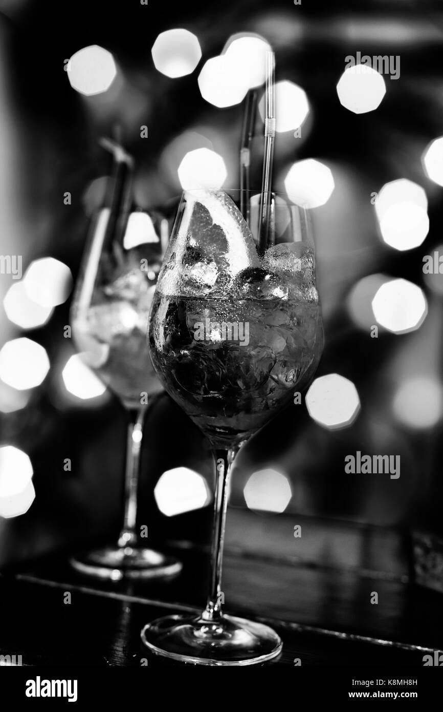 Yellow cocktail on blue Black and White Stock Photos & Images - Alamy