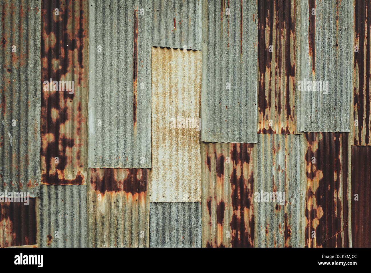 Old rusty corrugated tin zinc metal wall in vintage tone with ...