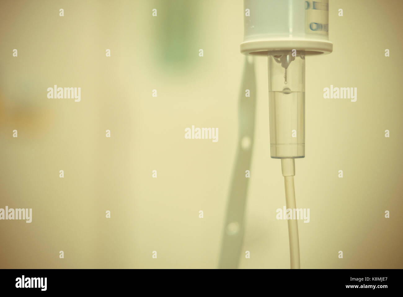 Close up saline solution drip for patient and infusion bottle with IV ...