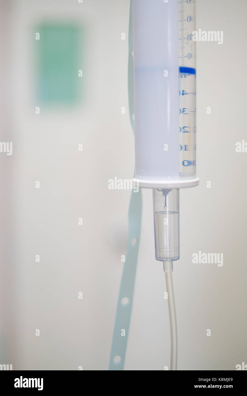 Close up saline solution drip for patient and infusion bottle with IV ...
