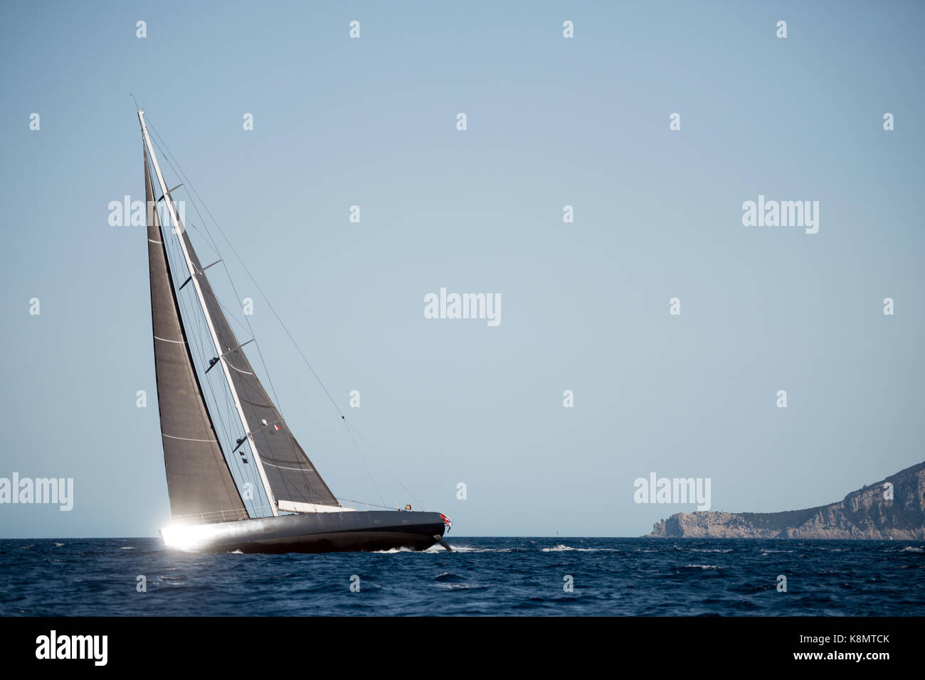 Black sailing yacht on the sea Stock Photo - Alamy