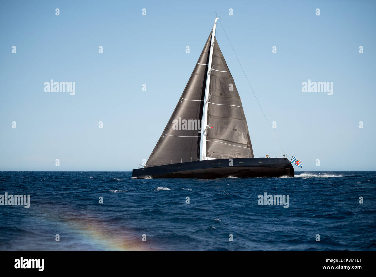 Black sailing yacht on the sea Stock Photo - Alamy