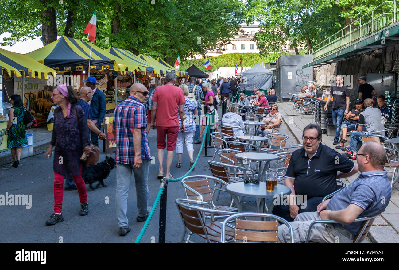 TURKU, FINLAND ON JUNE 30, 2017. Street view, people walk around stands ...