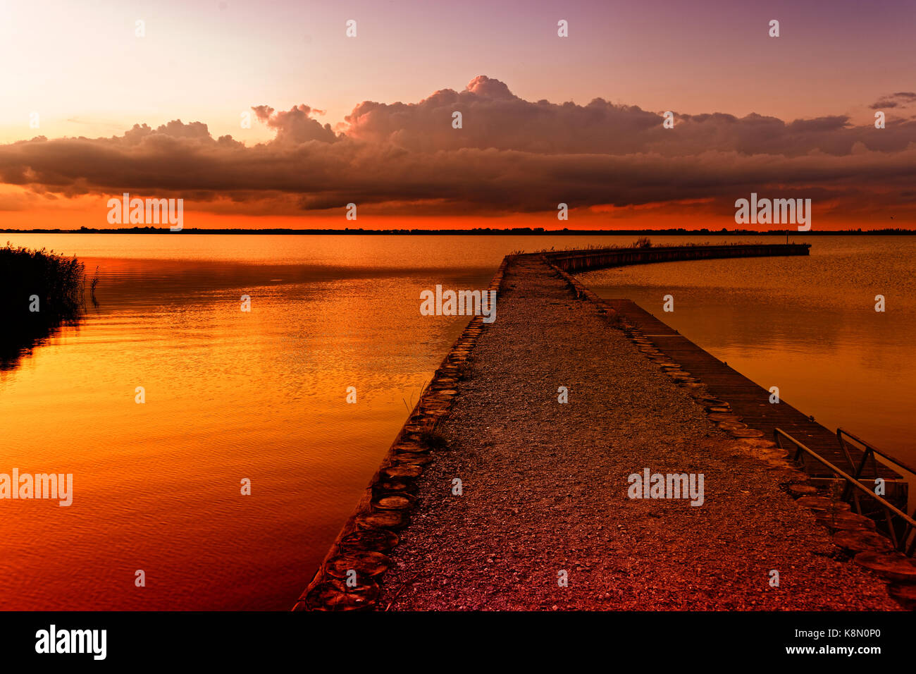 Sunset over calm lake. Colorful and vibrant landscape of lake Stock ...