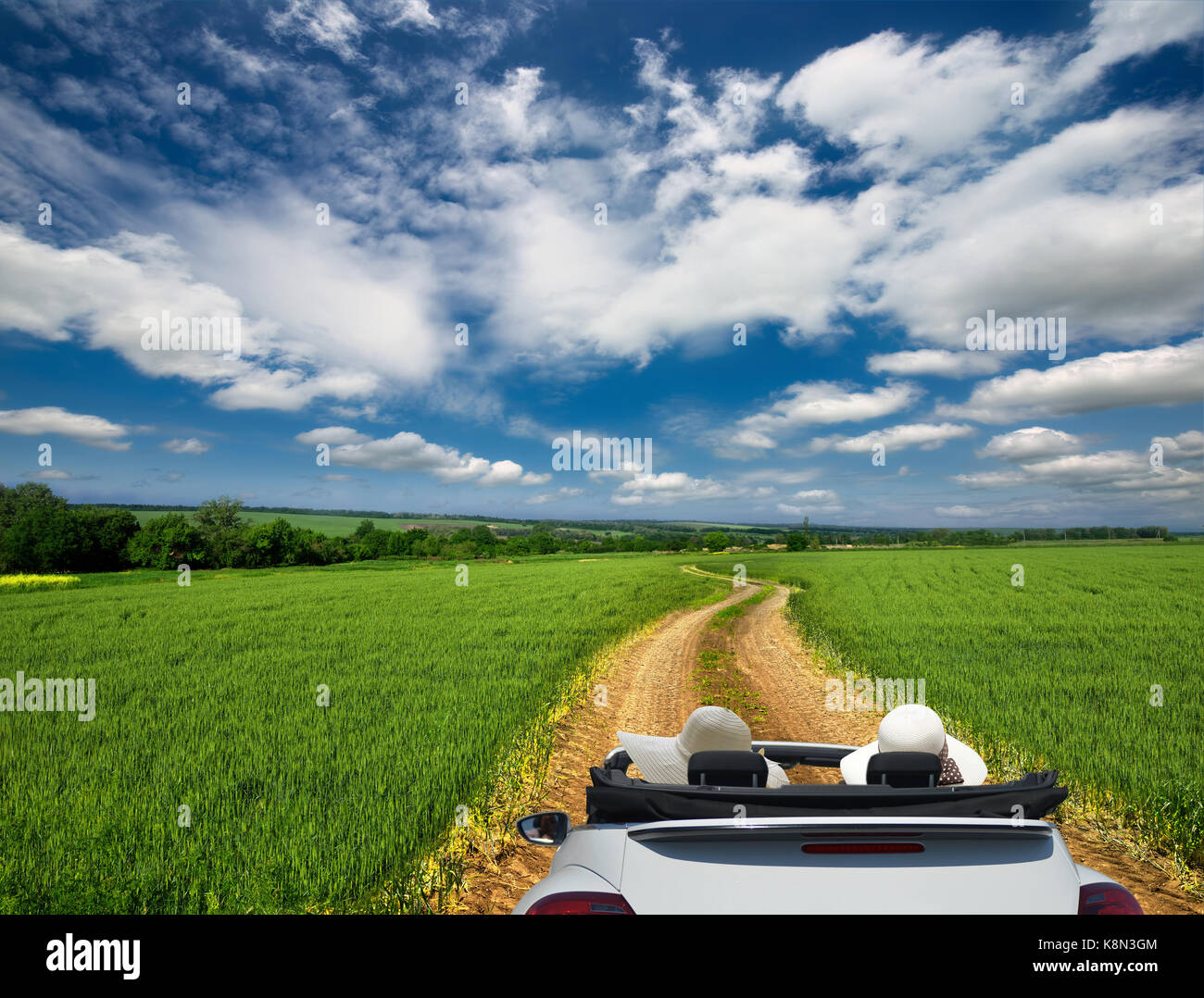 convertible car on a background field Stock Photo - Alamy