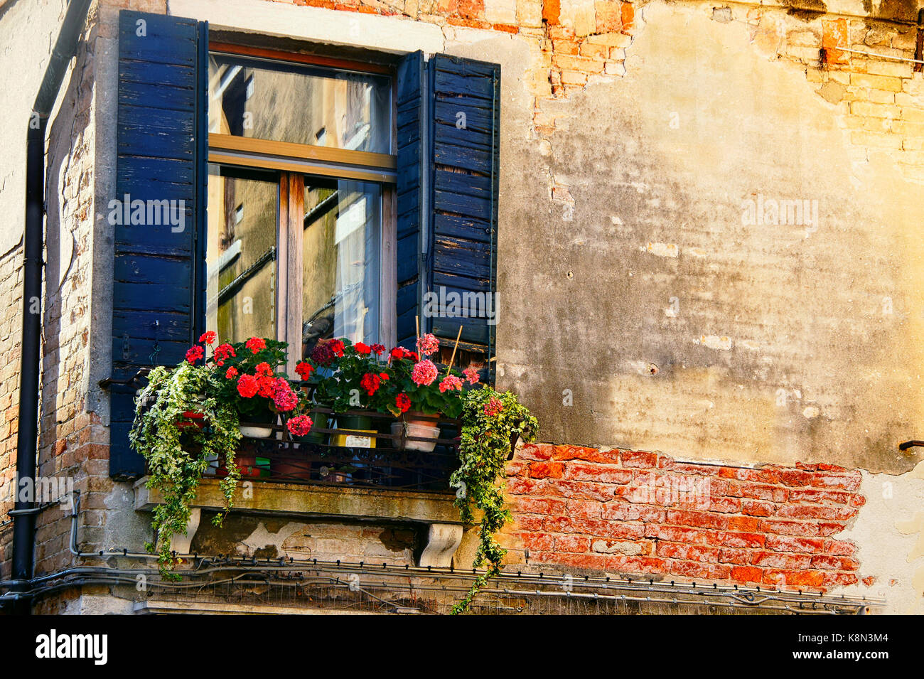 very old window in a building. Quarter of Venice. Italy Stock Photo - Alamy