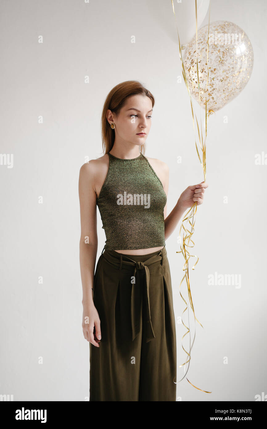 Fashion photo of beautiful woman with balloons. Girl posing. Studio ...