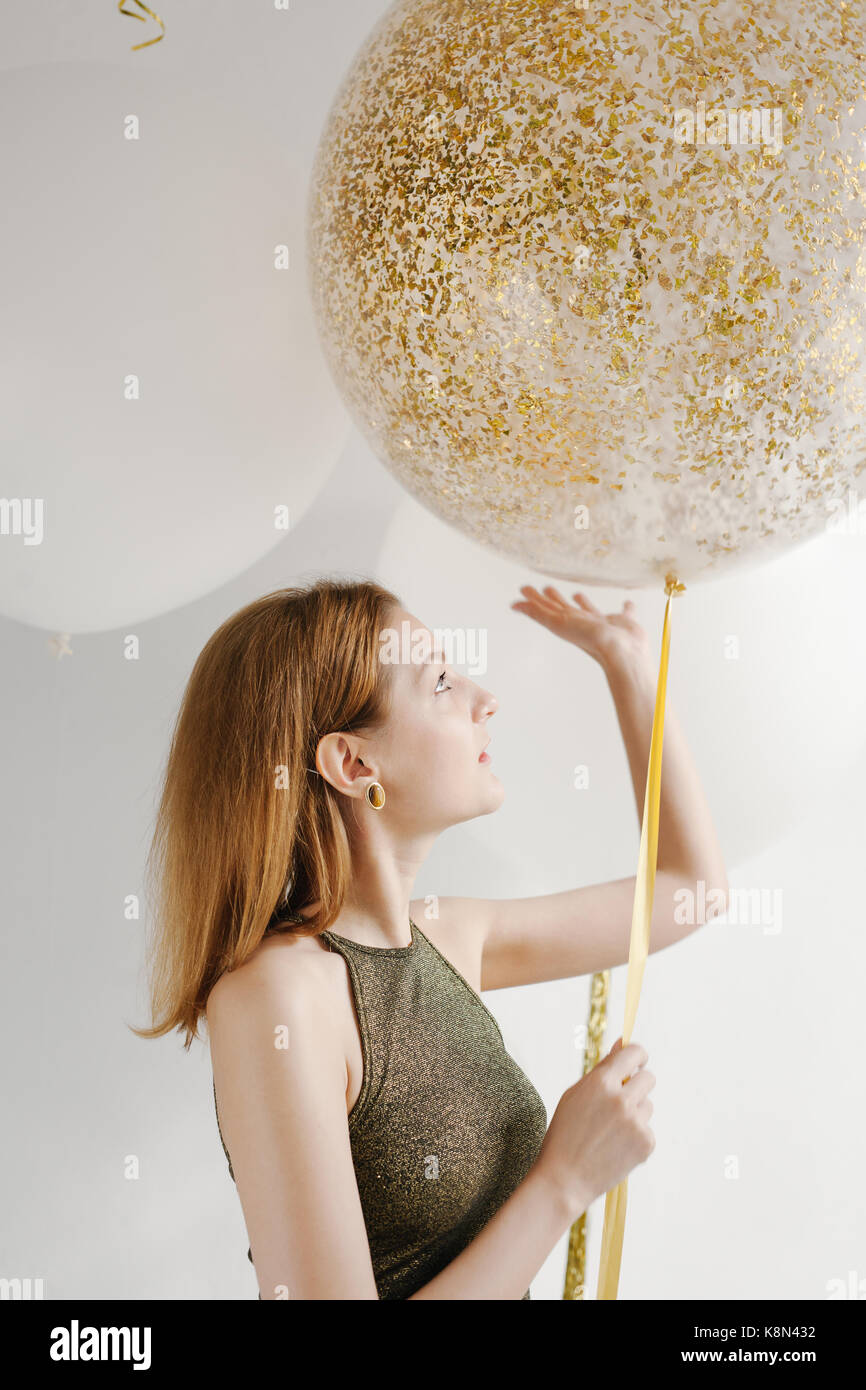Fashion photo of beautiful woman with balloons. Girl posing. Studio ...