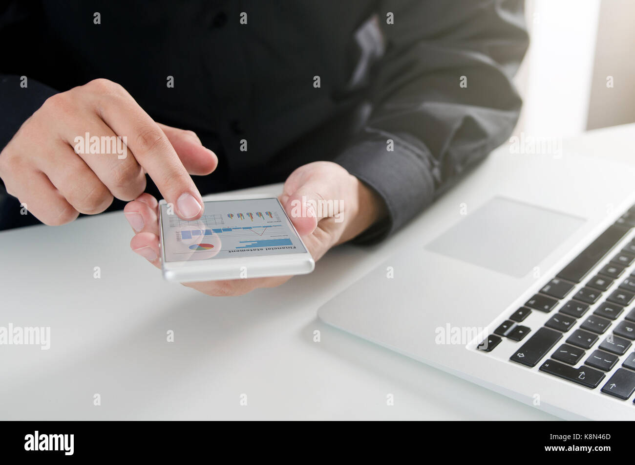 Man using mobile business report application. technology computer ...