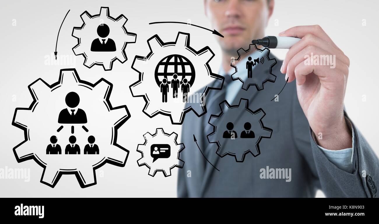 Digital composite of Business man interacting with people in cogs ...