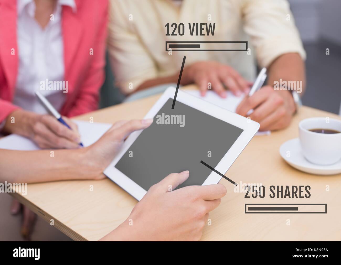 Digital composite of People on tablet with Views and Shares status bars ...