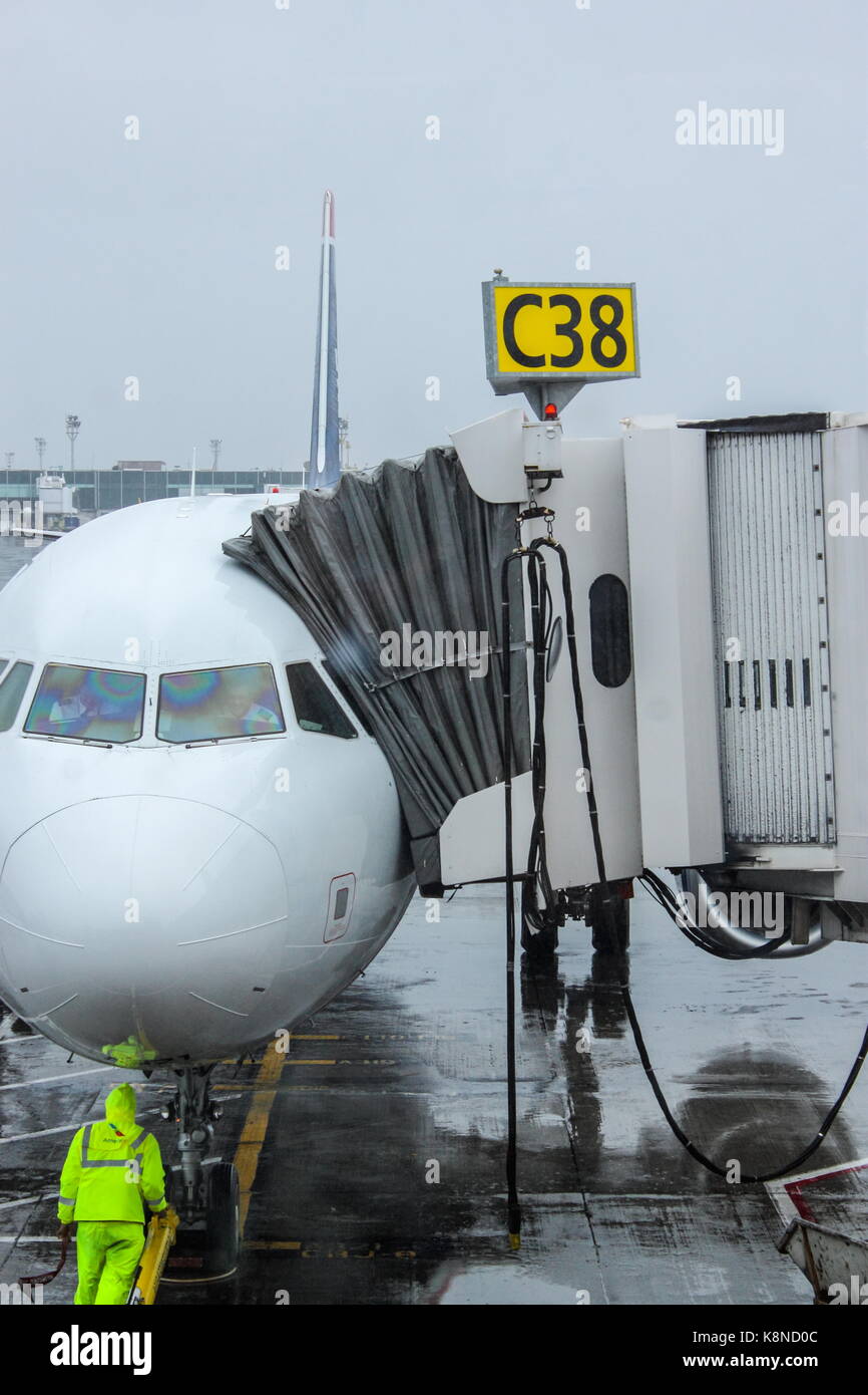 New York, USA - 30 September, 2016: Ground crew directing an incoming ...