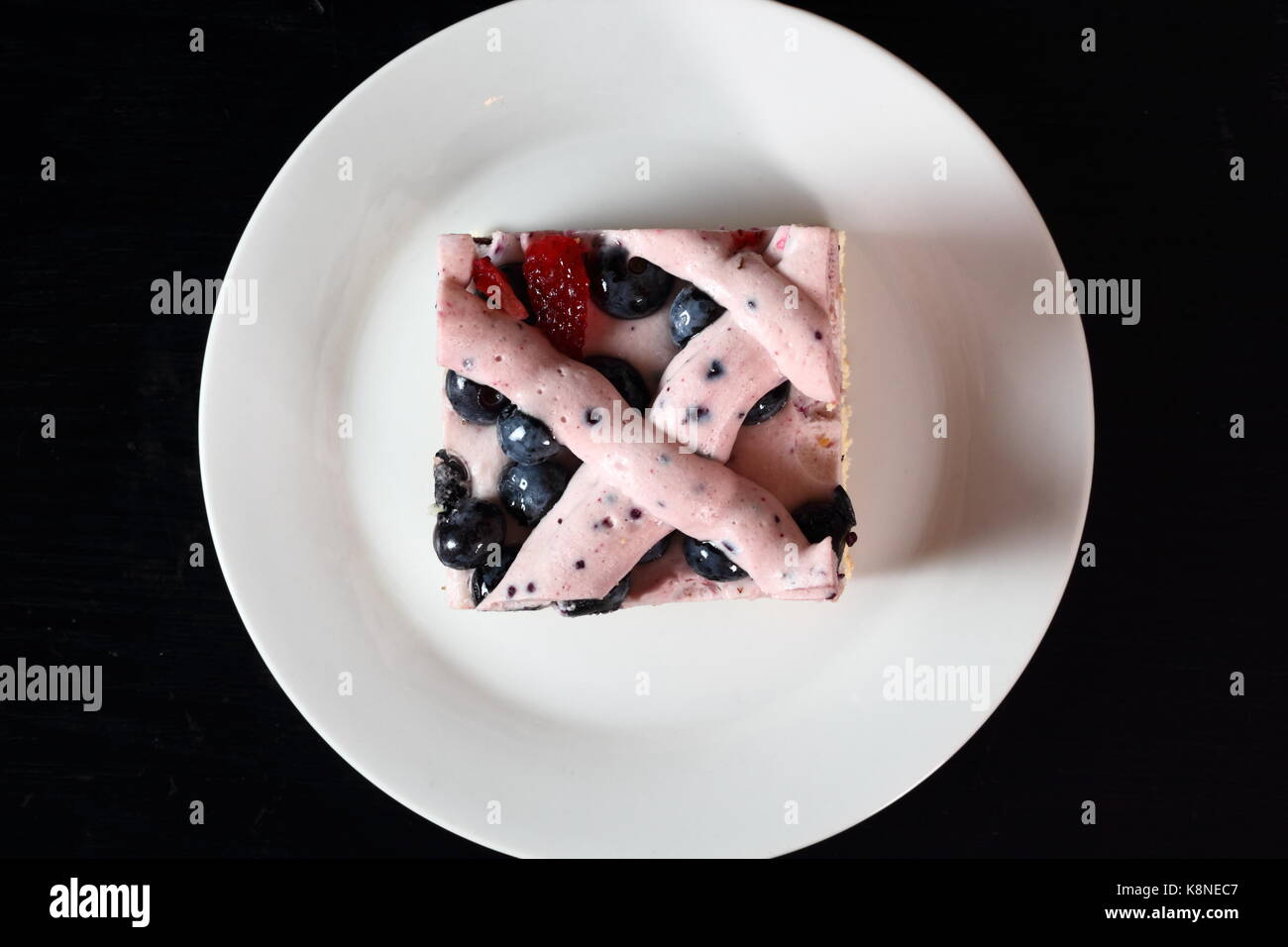 Cold cheesecake with blueberry and strawberry Stock Photo - Alamy