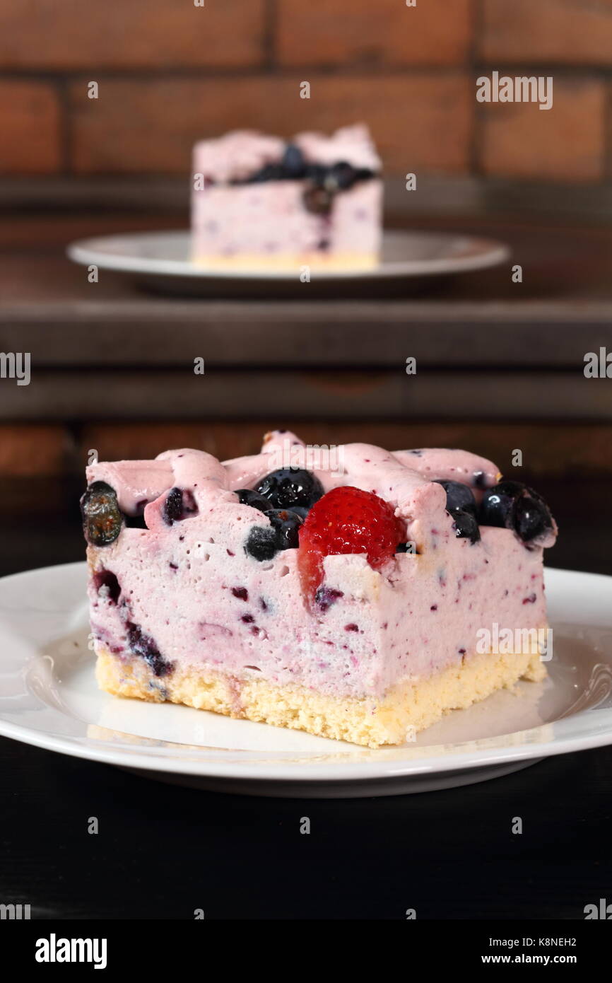 Cold cheesecake with blueberry and strawberry Stock Photo - Alamy