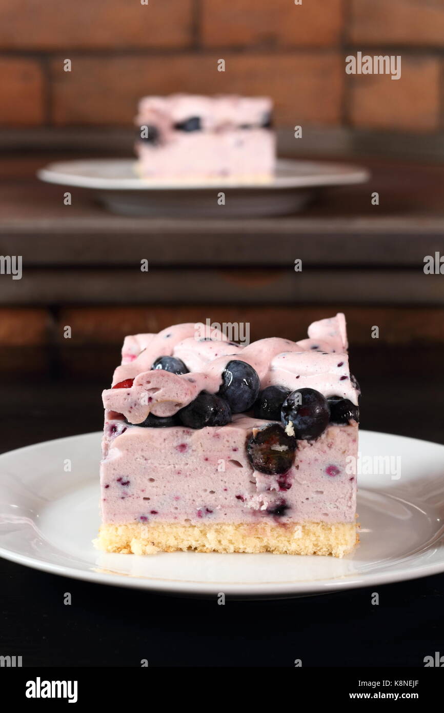 Cold cheesecake with blueberry and strawberry Stock Photo - Alamy