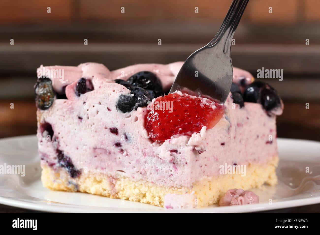 Cold cheesecake with blueberry and strawberry Stock Photo - Alamy