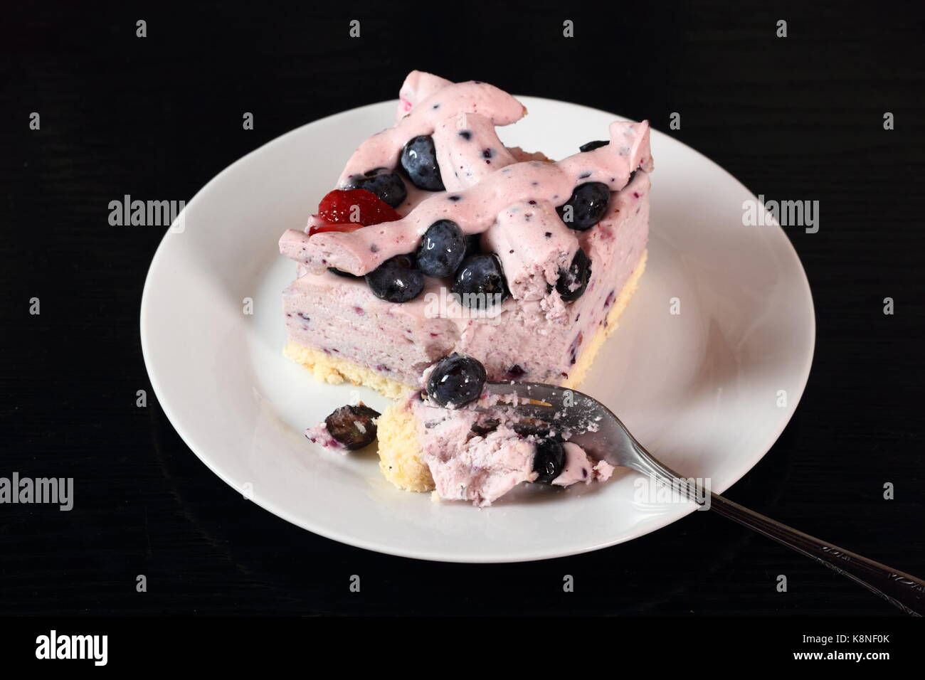 Cold cheesecake with blueberry and strawberry Stock Photo - Alamy