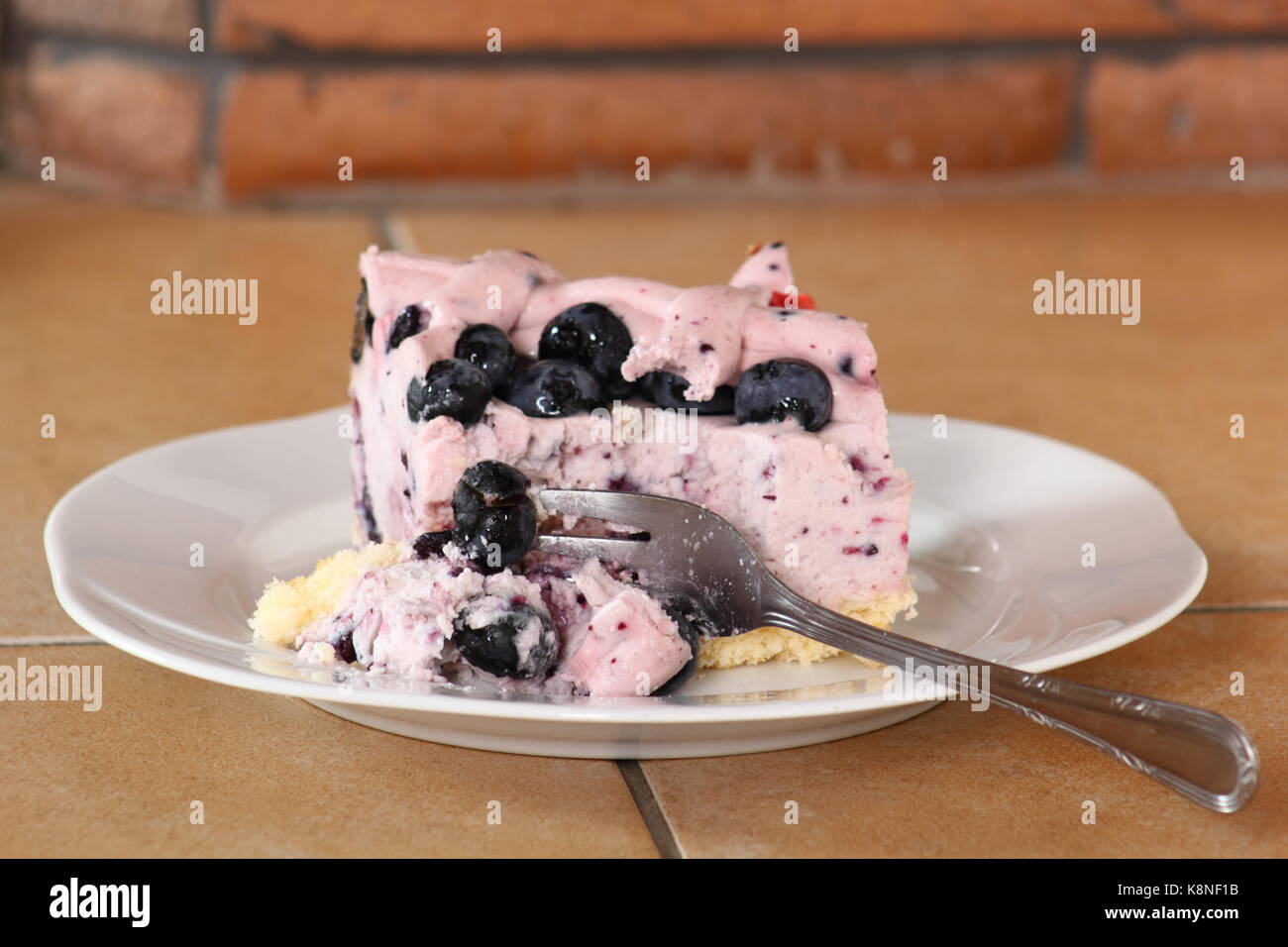 Cold cheesecake with blueberry and strawberry Stock Photo - Alamy