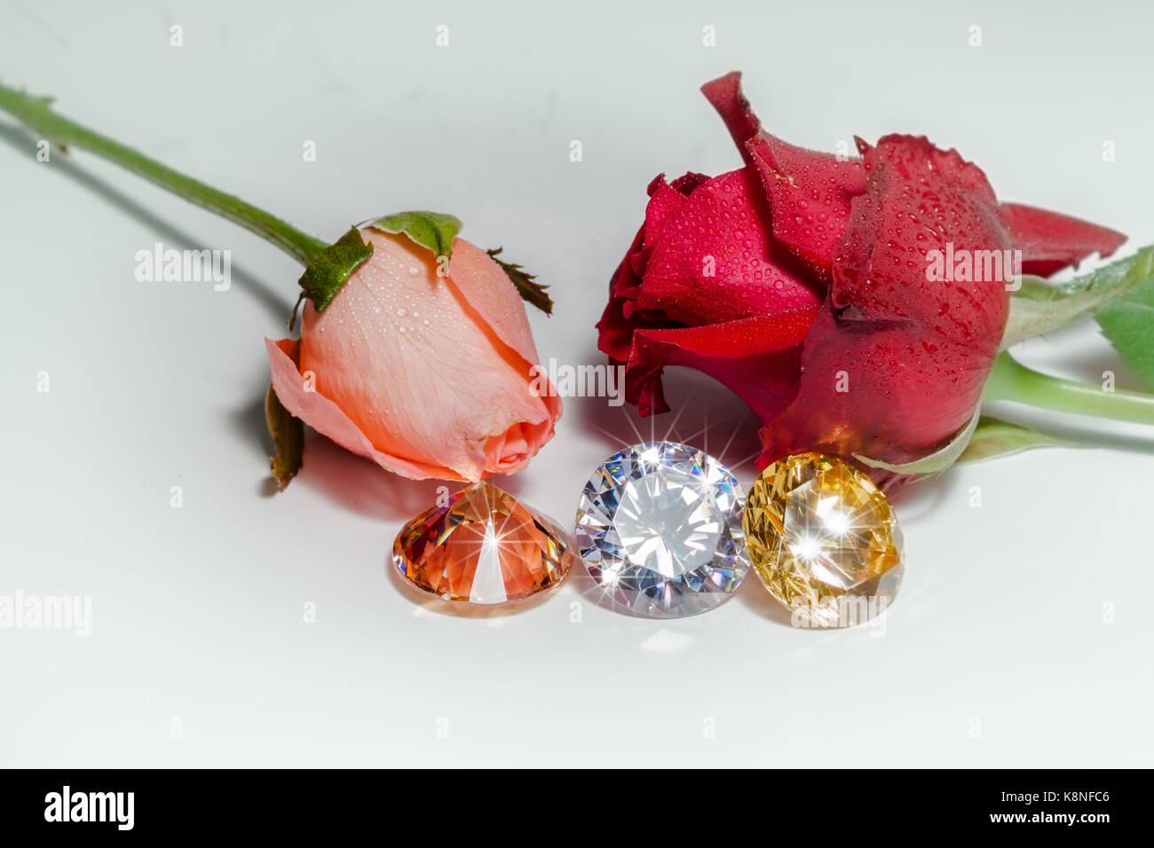 light pendant shine on the colorful gemstones on white background.pink ...