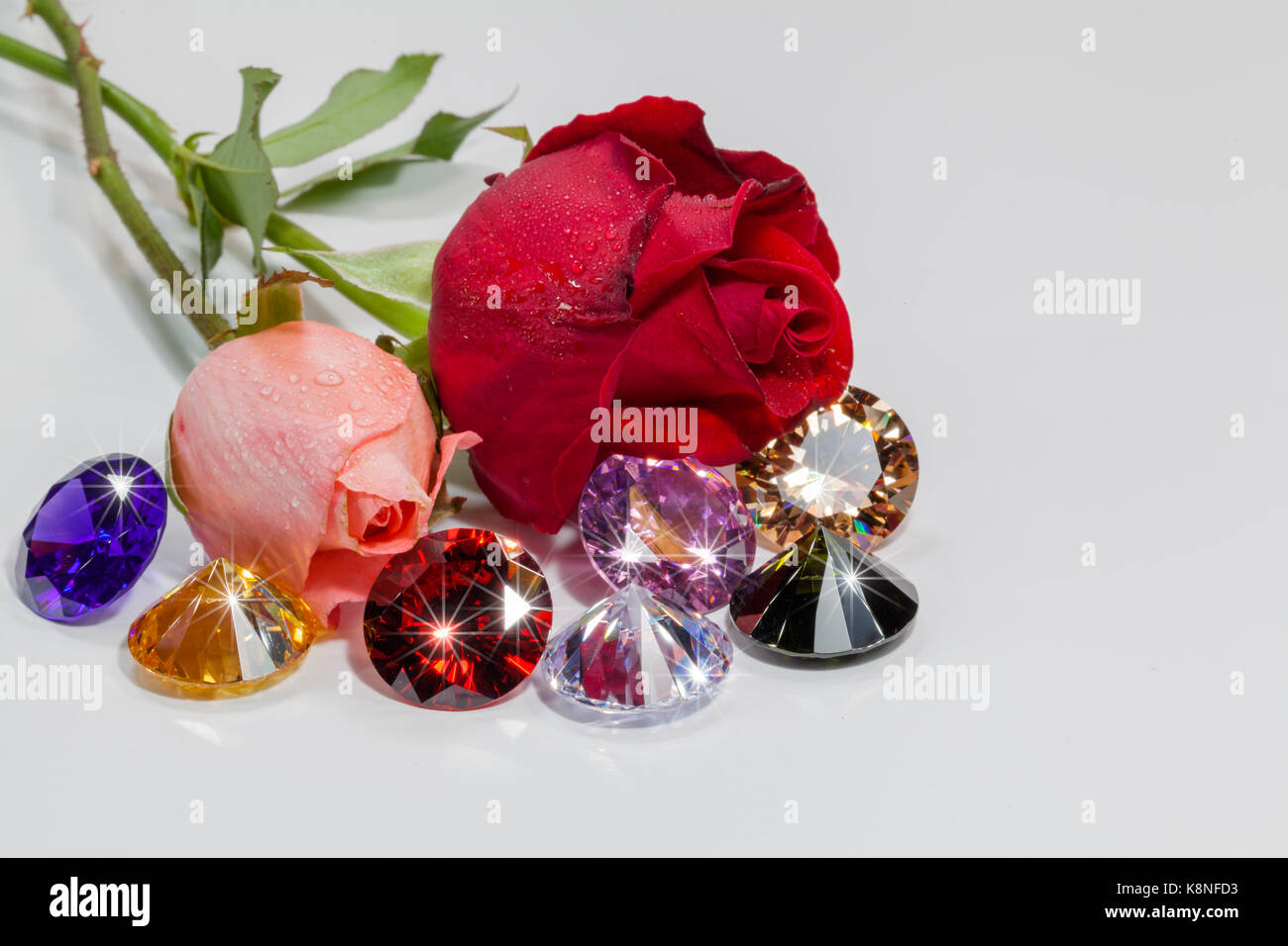 light pendant shine on the colorful gemstones on white background.pink ...