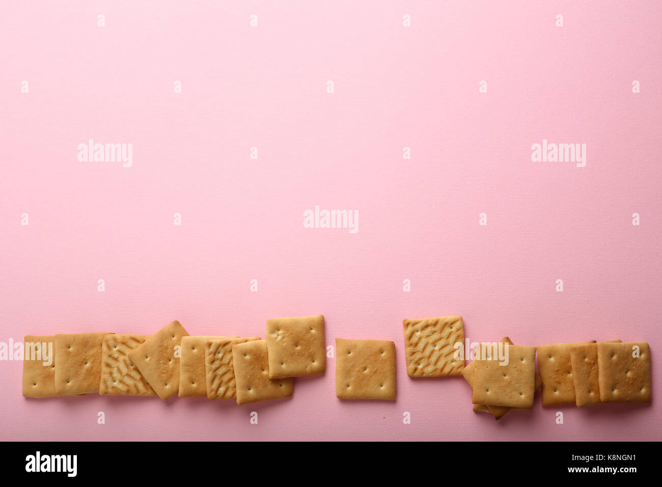 Pink cracker background, food flat lay Stock Photo - Alamy