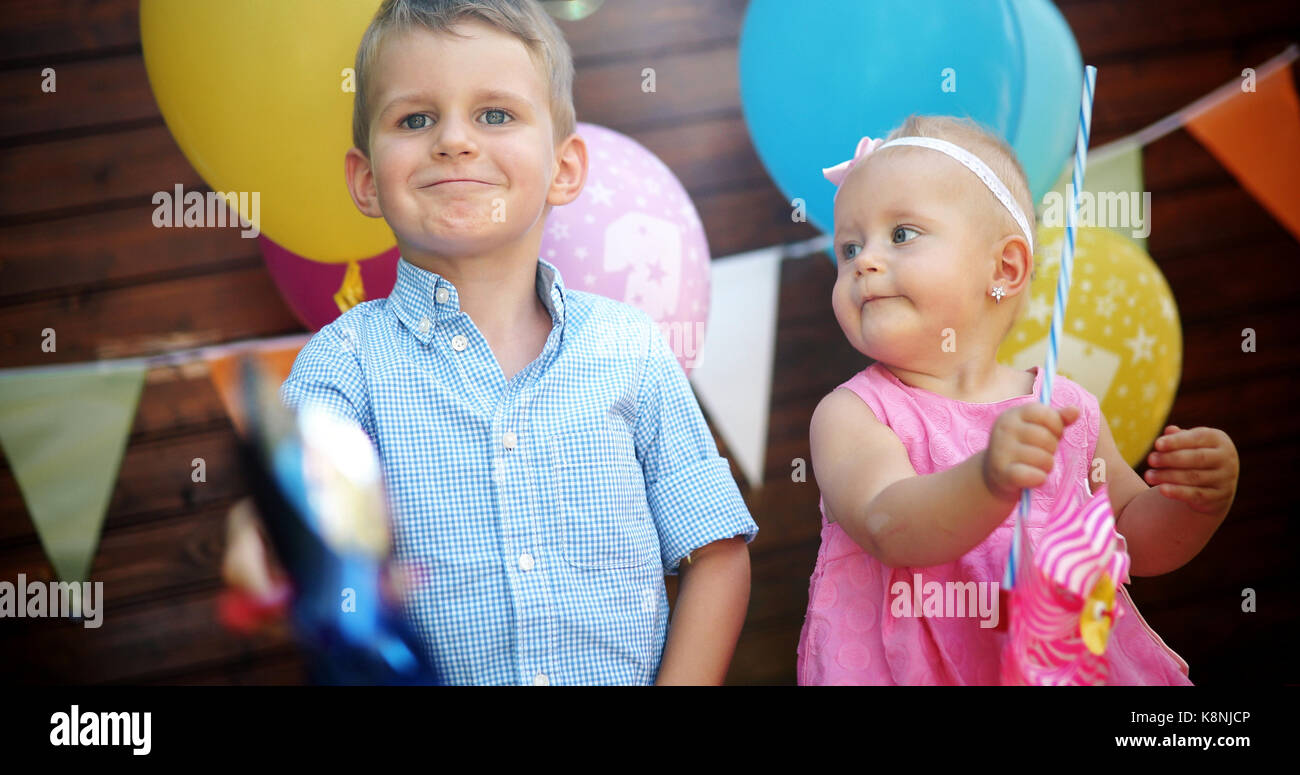 Happy young boy and little girl at birthday party Stock Photo - Alamy