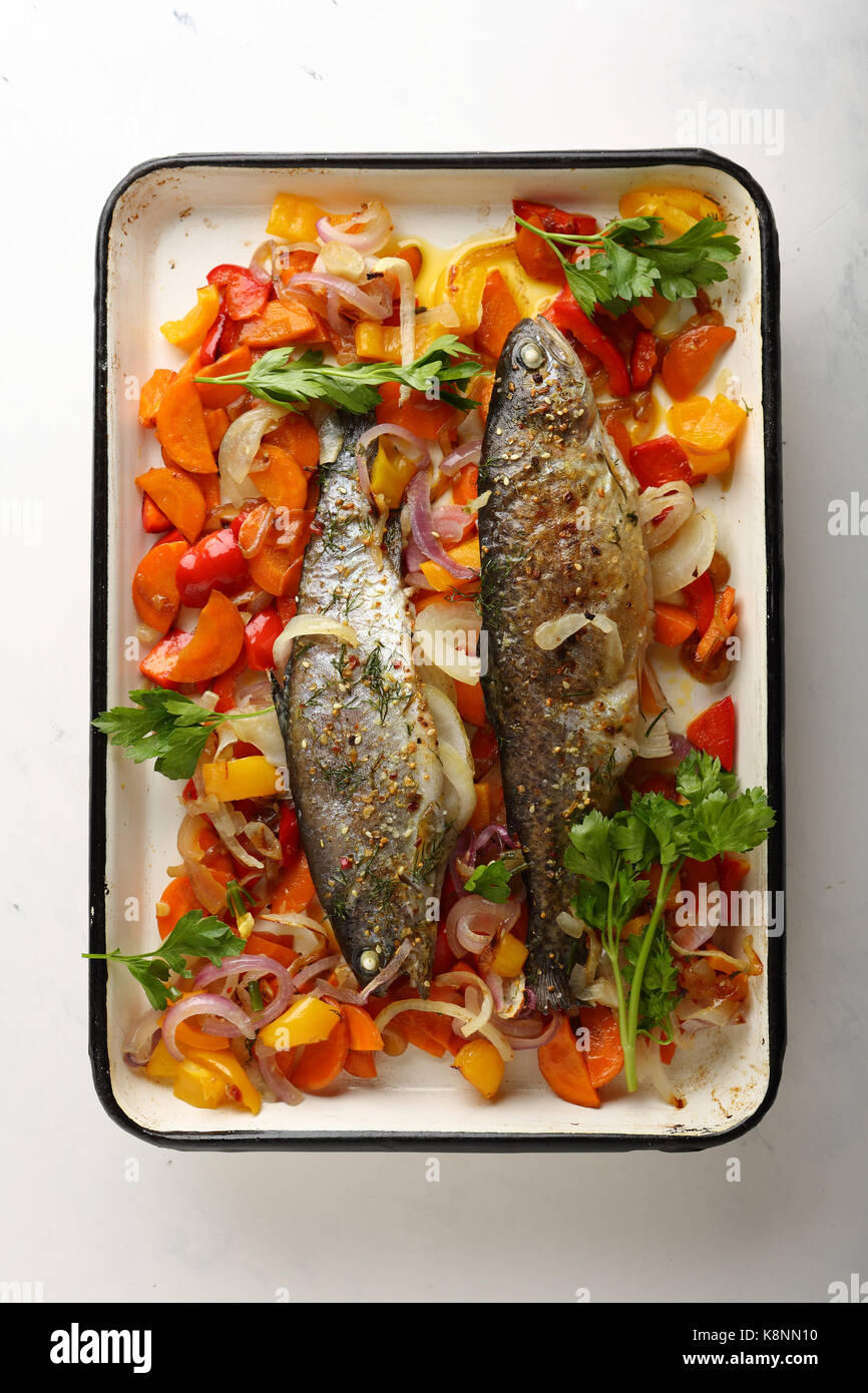Fish with vegetables, food top view Stock Photo - Alamy