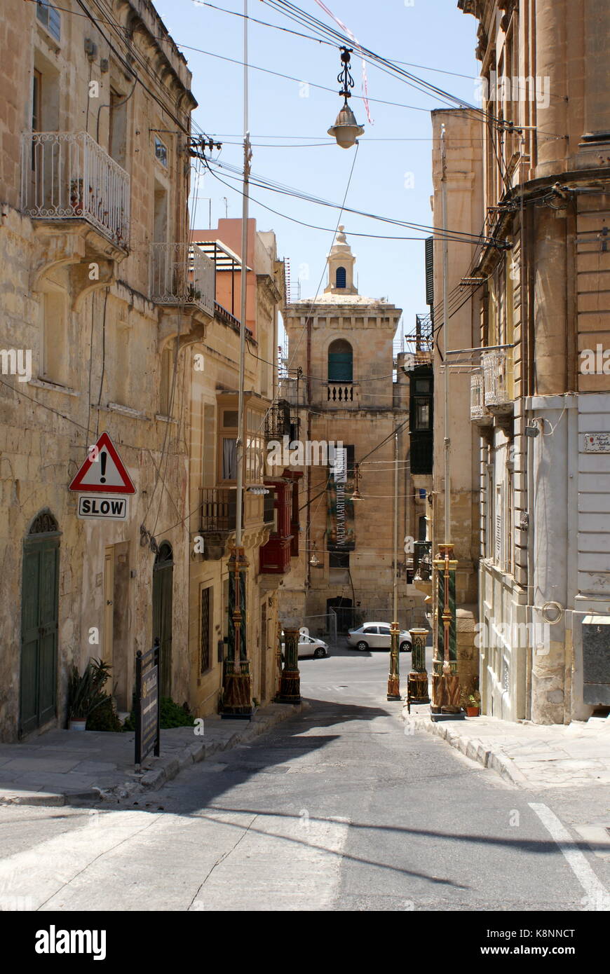 View down a typical narrow street, Birgu, Malta Stock Photo - Alamy