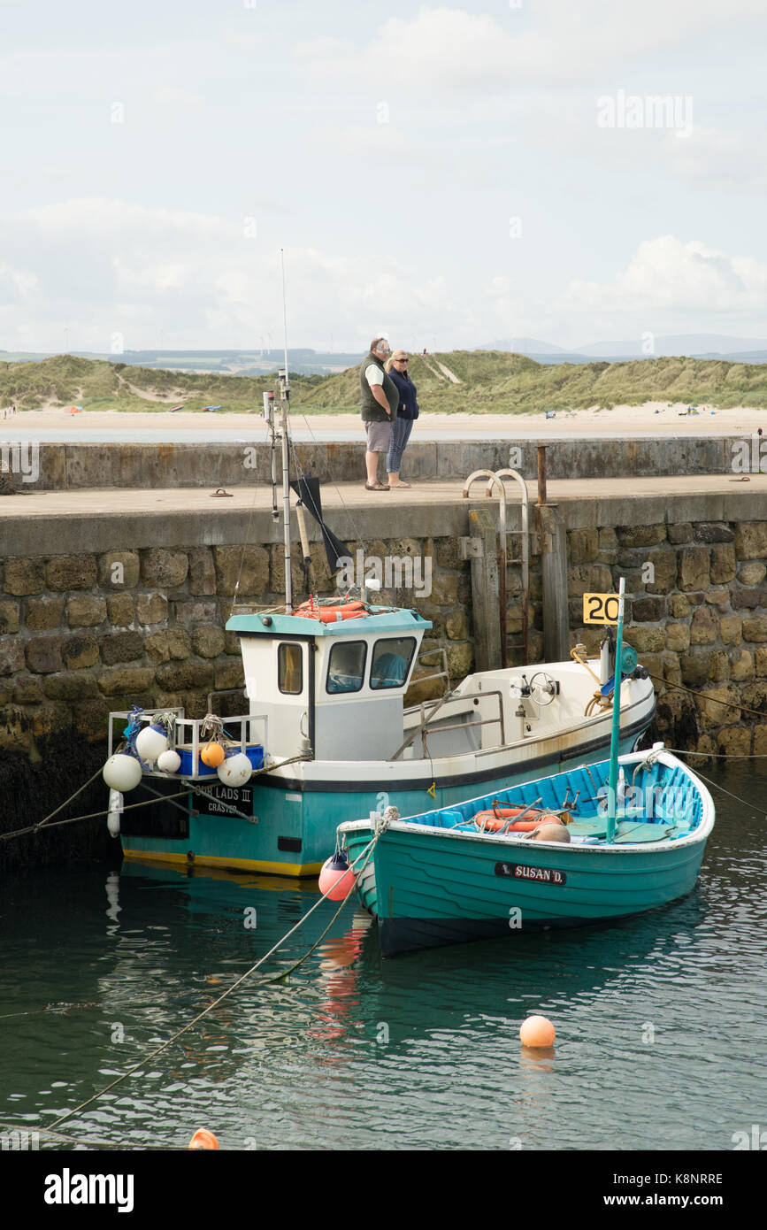 Blue fishing boats at Beadnell Harbour, Northumberland, England Stock ...