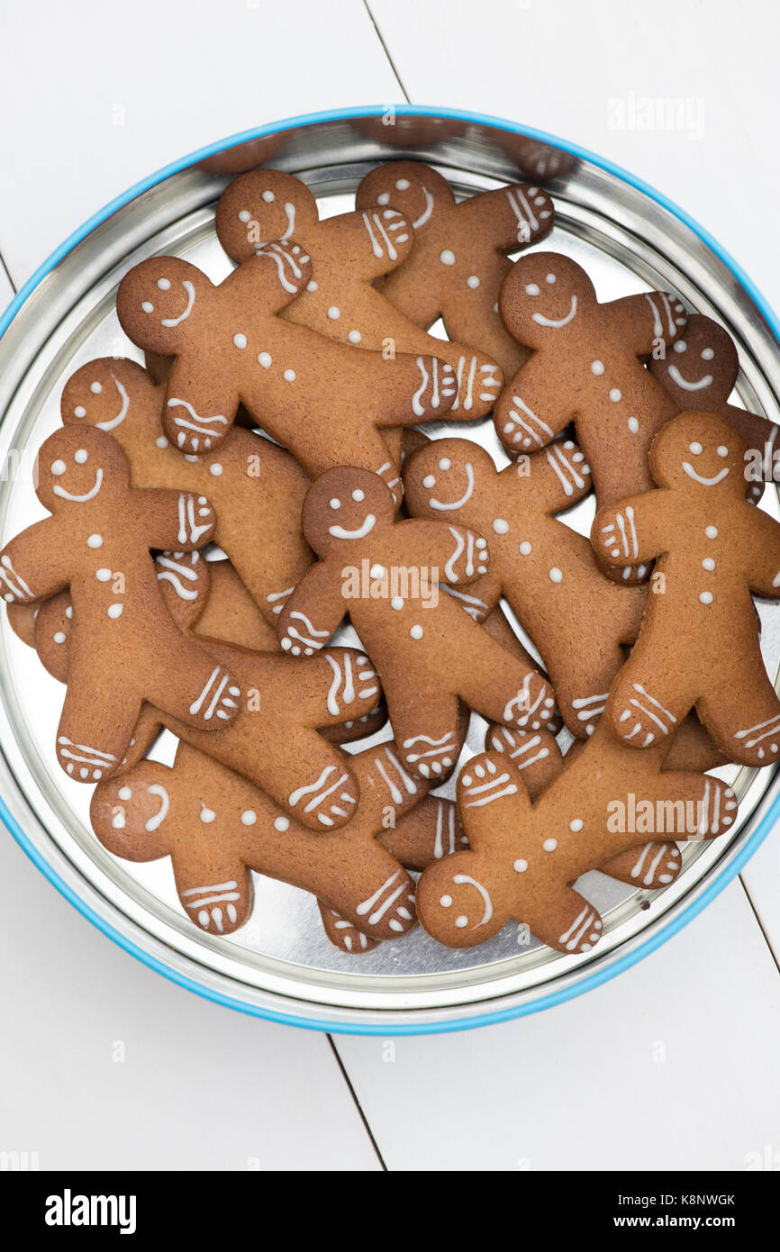 Gingerbread Men biscuits in a tin Stock Photo - Alamy